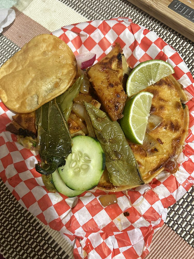 Crispy, cheesy, meaty perfection served on a checkered paper. These quesabirria tacos are what food dreams are made of.