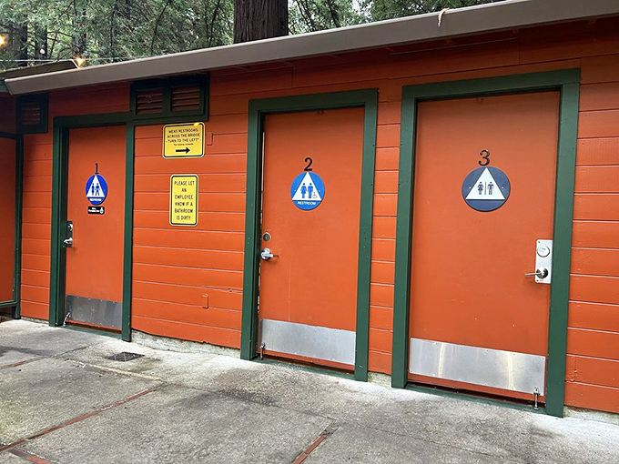 Even the restrooms maintain the Mystery Spot's signature orange and green color scheme – practical facilities with a touch of roadside charm.