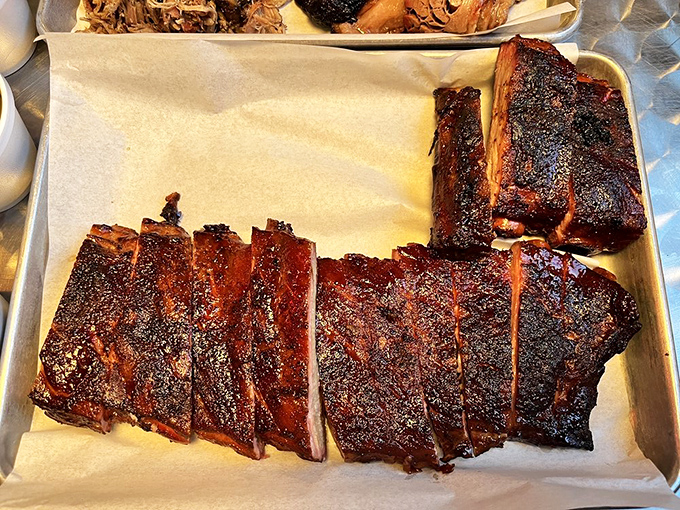 Ribs and brisket sharing a tray like old friends catching up. That bark is the result of time, patience, and smoke&mdash;three ingredients you can't rush.