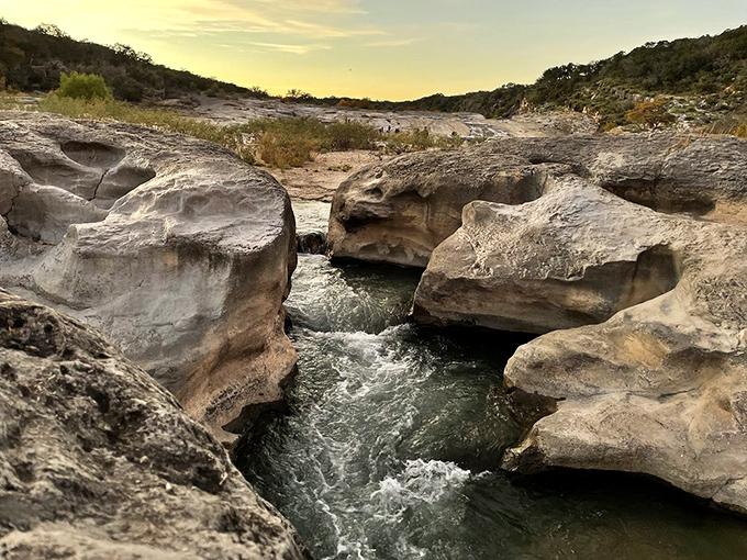 Water finding its path of least resistance, much like weekend visitors heading straight for the most photogenic spots in the park.