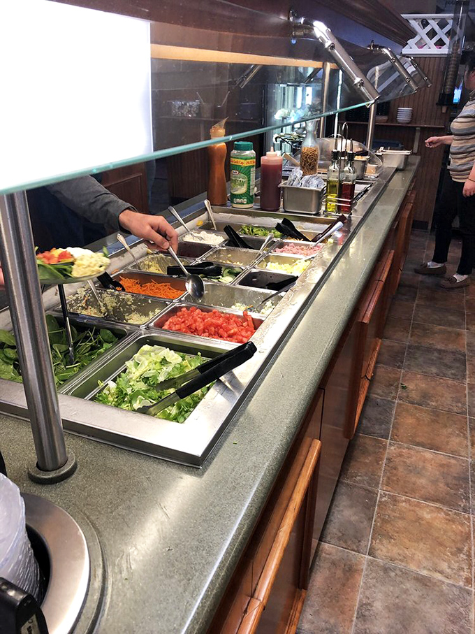 The fresh salad bar offers crisp vegetables and colorful toppings for those seeking lighter fare options.