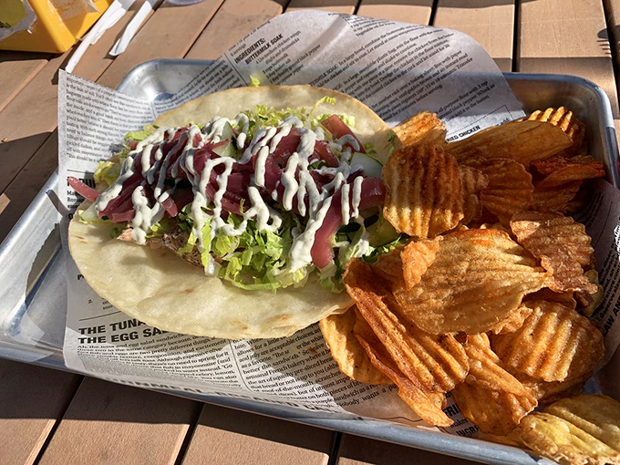 That tuna taco doesn't need to shout to get your attention—the fresh fish draped in a drizzle of sauce speaks volumes about Wheelhouse's seafood philosophy.