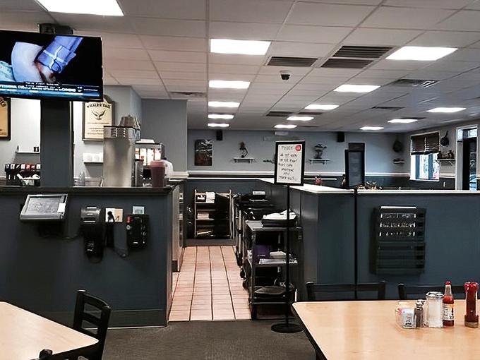 Where breakfast magic happens &ndash; the pass-through window offering glimpses into the choreographed chaos that somehow results in perfect eggs every time.