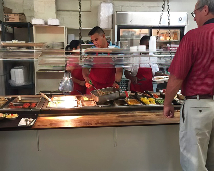 The serving line &ndash; where the staff's practiced hands have been dishing out Southern classics with mathematical precision for decades.