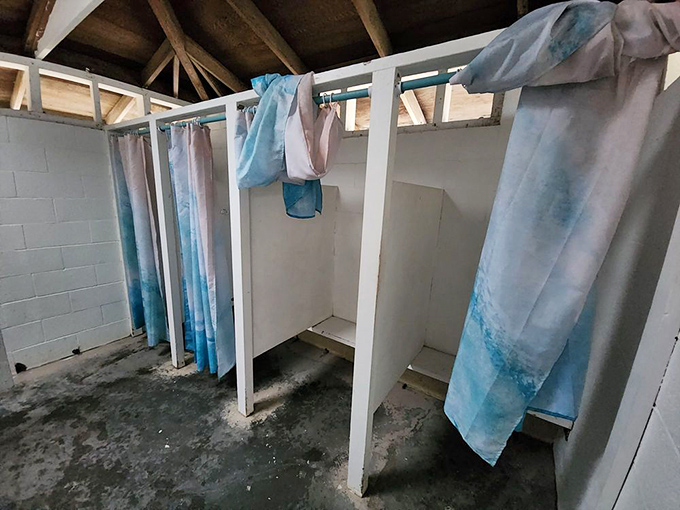 Beach shower stalls that have seen it all&mdash;sand in places you didn't know existed and the relief of freshwater after a salty swim.