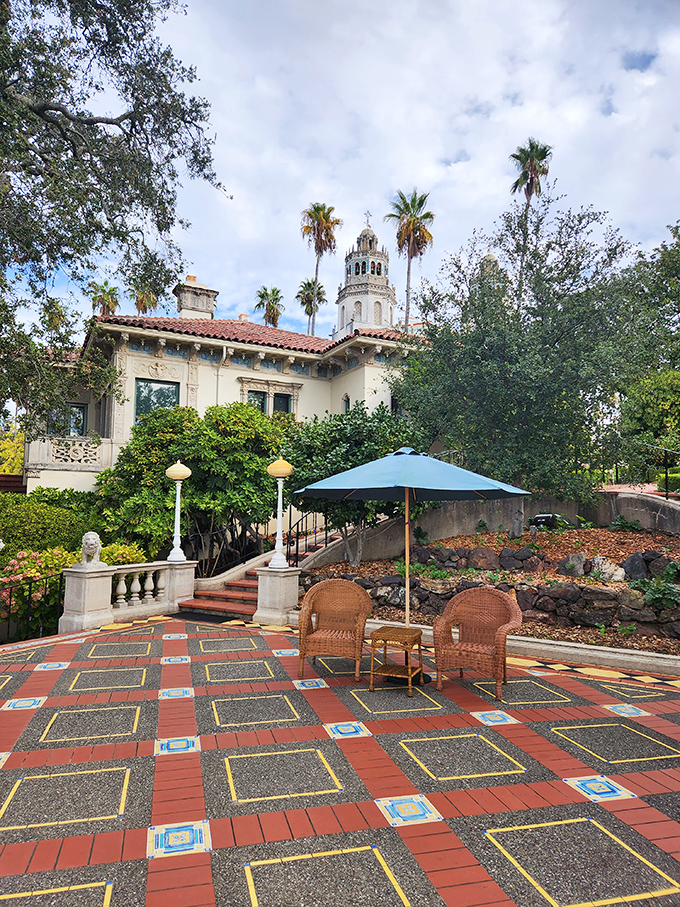 This colorful tiled terrace with wicker chairs offers a moment to catch your breath and contemplate how your patio furniture suddenly seems tragically ordinary.