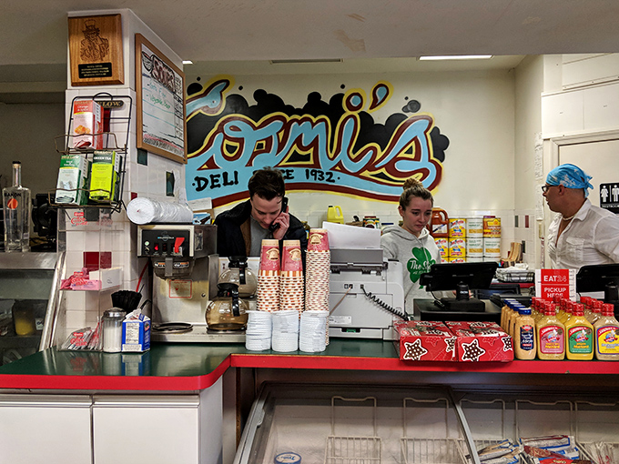 The sandwich architects at work. These aren't just employees; they're the guardians of a culinary tradition Philadelphians hold sacred.