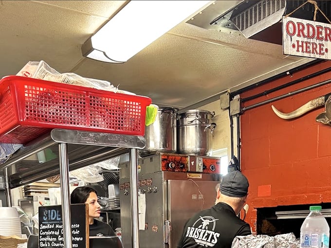 The open kitchen reveals the choreography of barbecue service. When you're cooking food this good, there's nothing to hide behind fancy walls.