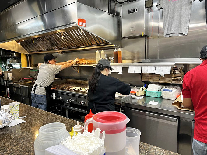 The kitchen choreography is mesmerizing&mdash;spatulas flying, meat sizzling, and sandwiches emerging like edible works of art. True craftspeople at work.