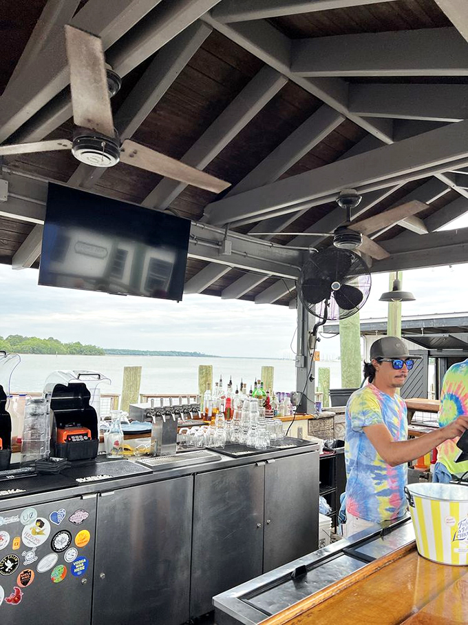 The outdoor bar, where drinks flow as steadily as the tides and views compete with cocktails for your attention.