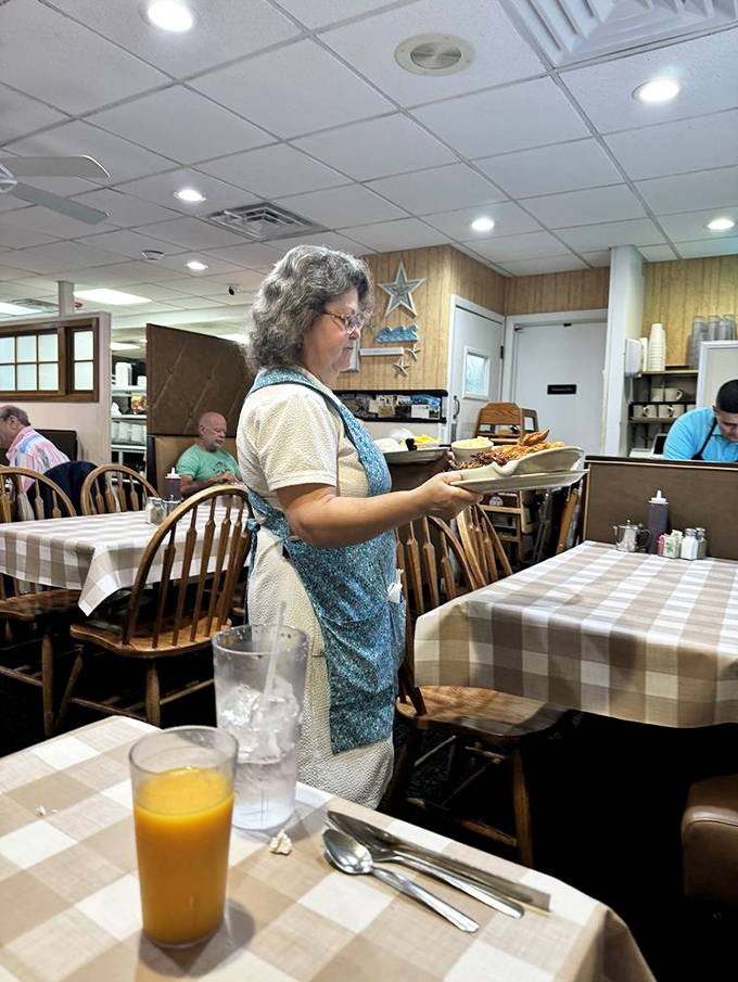 Servers moving with the precision of dancers and the memory of elephants. The aprons aren't uniforms&mdash;they're badges of honor.