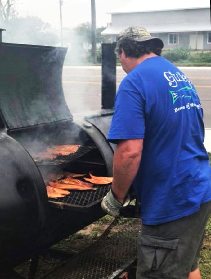 The magic happens when smoke meets mullet. Like watching Michelangelo paint, except you get to eat the masterpiece afterward.