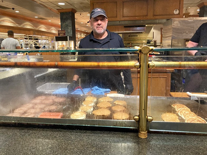 The carving station becomes dinner theater where skilled staff transform roasts into edible works of pure art.