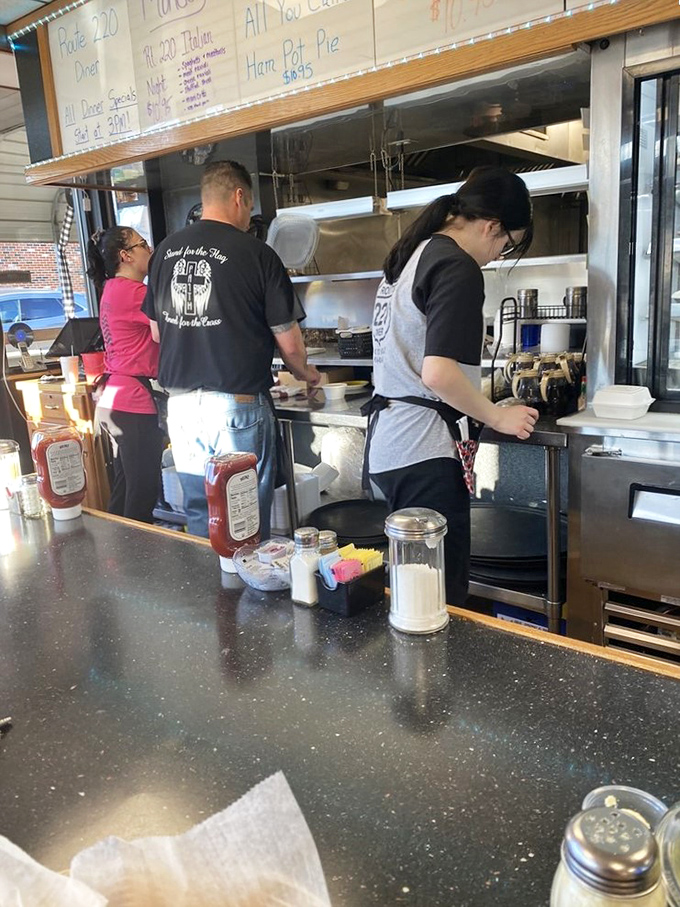 The open kitchen &ndash; where breakfast dreams come true and the staff orchestrates the morning symphony of sizzling bacon and clinking plates.