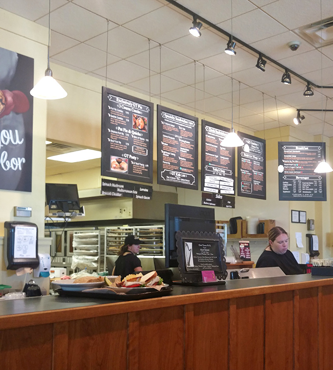 The menu board looms large with possibilities—each option a doorway to flavor combinations that somehow taste exactly like Michigan.