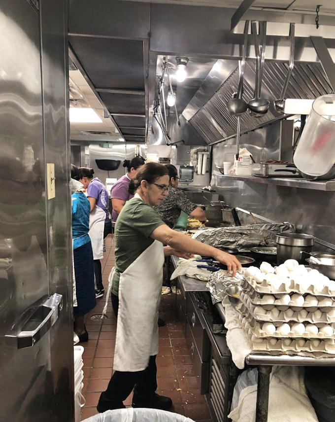 Behind every great pie is a kitchen staff that knows exactly what they're doing. Those stacks of egg cartons hint at the fresh ingredients going into every dish.
