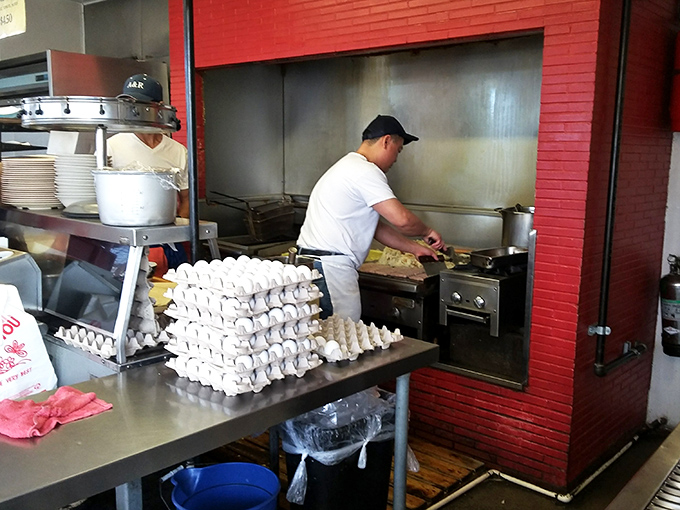 Behind every great breakfast spot is a dedicated cook who understands that eggs and potatoes are serious business, especially before 10 AM.