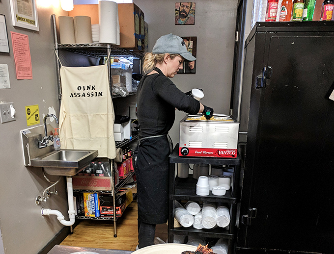 Behind every great barbecue joint is someone wearing the "Oink Assassin" apron with pride, crafting tomorrow's sold-out specials with practiced hands.
