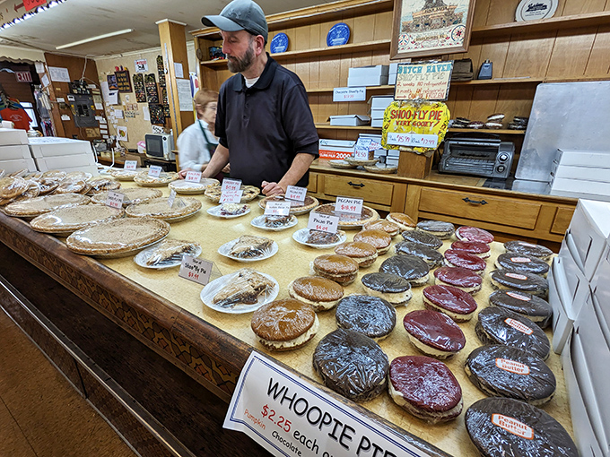 The pie whisperer at work, surrounded by his circular masterpieces. Each one represents generations of Pennsylvania Dutch baking tradition.