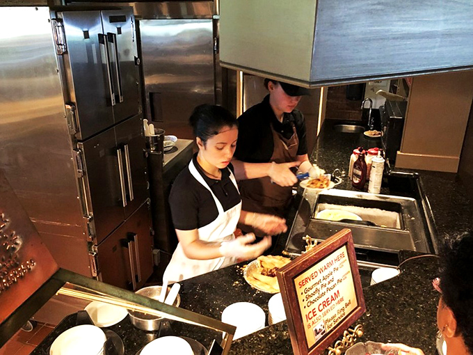 Behind-the-scenes magic: dedicated staff ensuring every dish meets the high standards diners expect here.