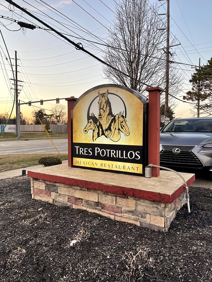 The restaurant's sign stands proud against the sky, those three horses promising a gallop through authentic Mexican flavors just steps away.