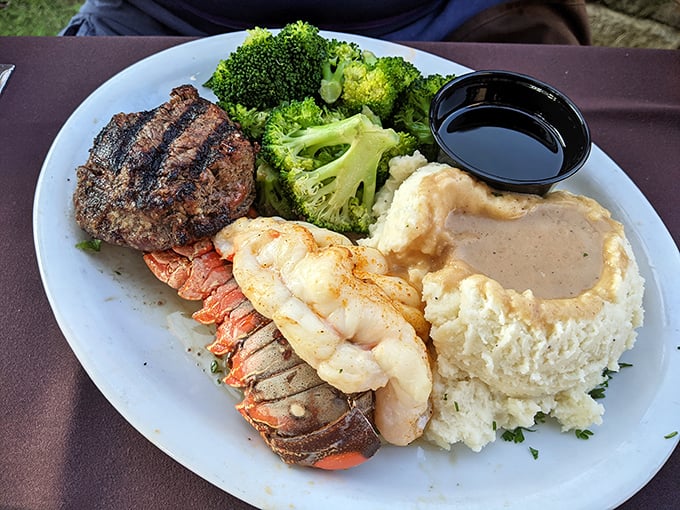 Surf and turf: where land and sea call a delicious truce on your plate, accompanied by mashed potatoes smooth enough to skate on.