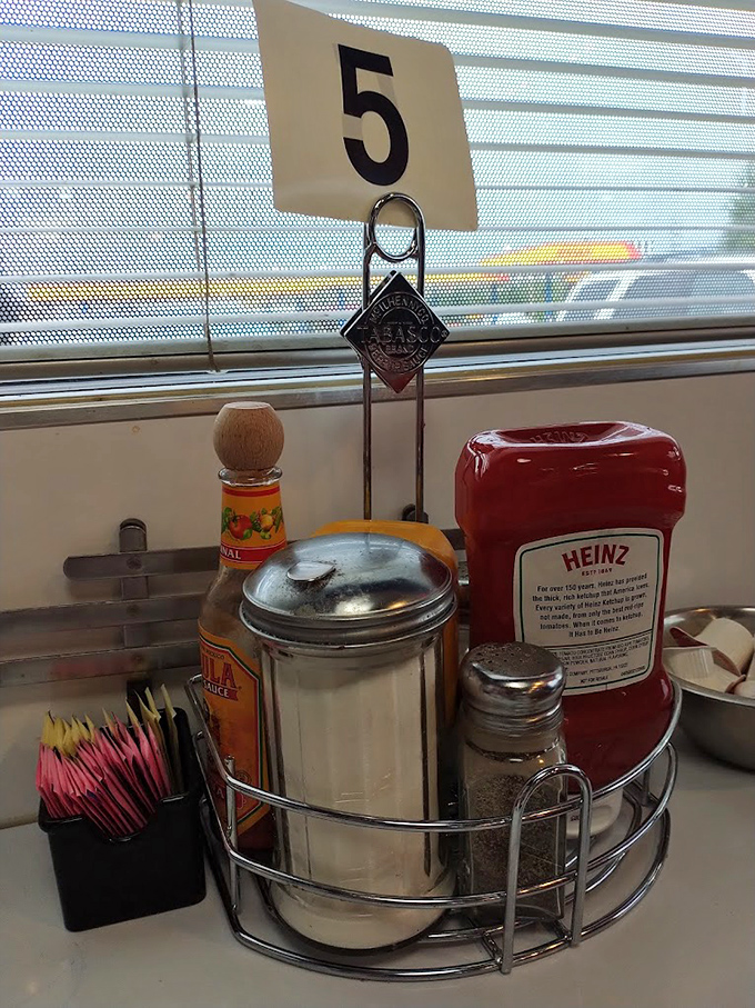 Table 5's condiment caddy&mdash;the silent supporting cast that deserves its own credit roll in the meal's final production.