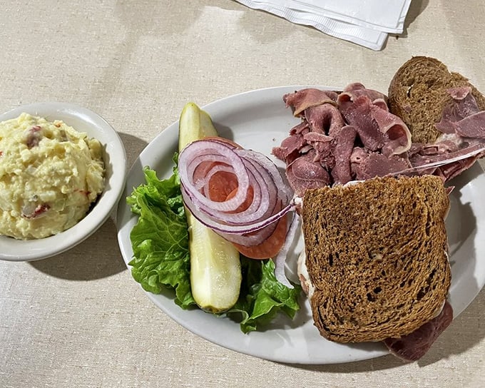 Pumpernickel so dark and substantial it could be mistaken for Texas soil, topped with meat so tender it barely requires chewing.
