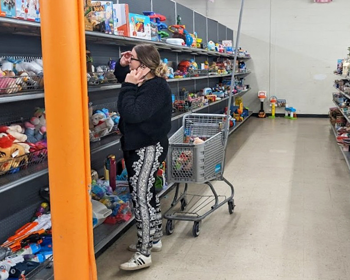 The toy aisle: where nostalgia meets practicality. One shopper finds the perfect plaything while her little one dreams of all the possibilities.