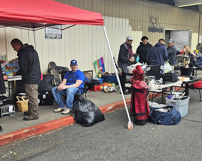 Vendors create impromptu storefronts under the Portland sky. The red canopy adds a splash of color to this weekend retail therapy session.