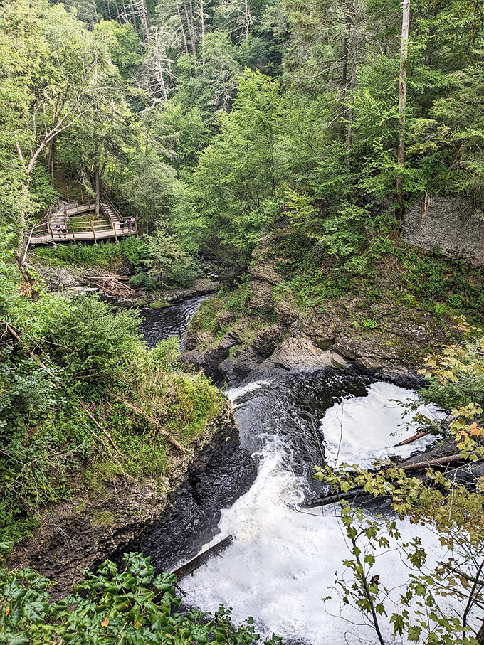 Standing at the top of the falls offers perspective that no motivational poster can match. Life's problems seem smaller from up here.