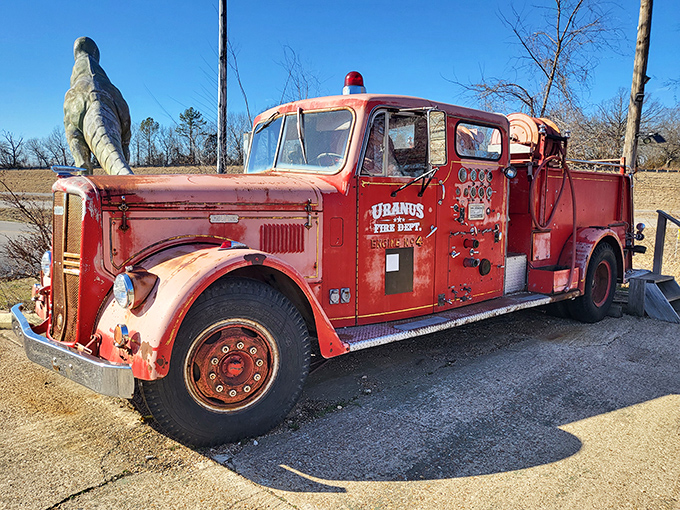 The vintage Uranus Fire Department truck has seen better days, but its weathered charm perfectly captures the authentic roadside attraction aesthetic.