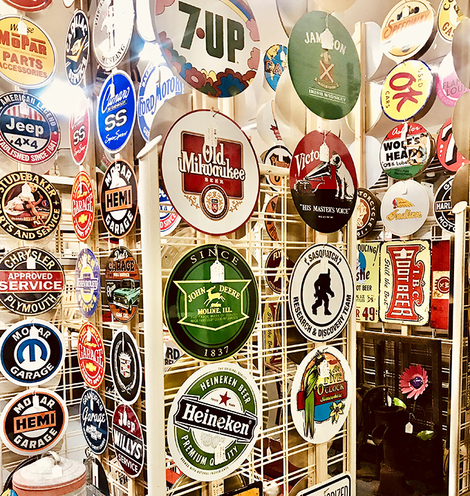 A gallery of advertising history where brands speak across decades. That Mopar sign probably hung in a garage where '57 Chevys were still new.