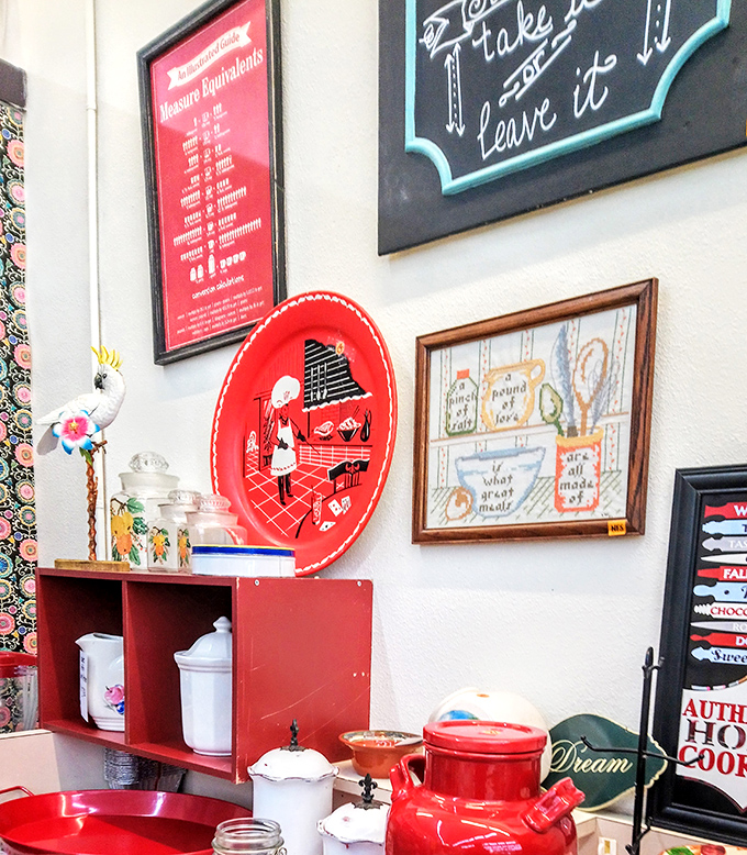Kitchen wisdom on display. That vintage red tray isn't just decorative&mdash;it's a time portal to grandmother's cooking advice.