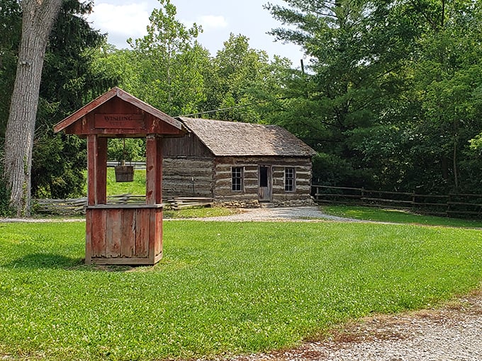 This rustic log cabin and wishing well look like they're waiting for Laura Ingalls Wilder to skip by with a bonnet and a basket.