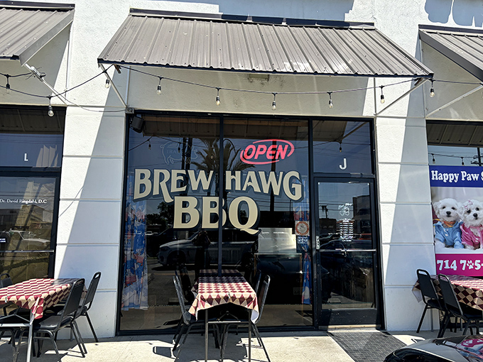 Brew Hawg BBQ's simple storefront with checkered tablecloths promises smoky delights without any pretension.