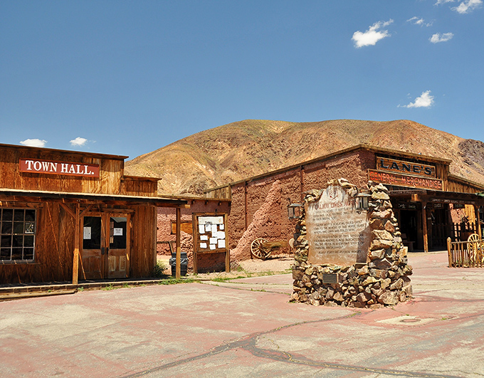 Calico Ghost Town's weathered buildings tell tales of silver strikes and broken dreams against a backdrop of desert hills.