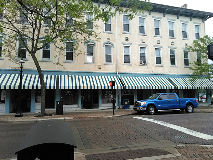 Those large windows offer a tantalizing glimpse into a cozy interior where pizza magic happens daily.