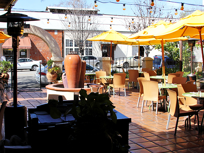 Agave Maria's sun-drenched patio invites lingering conversations over margaritas, where string lights stand ready for when day surrenders to evening.