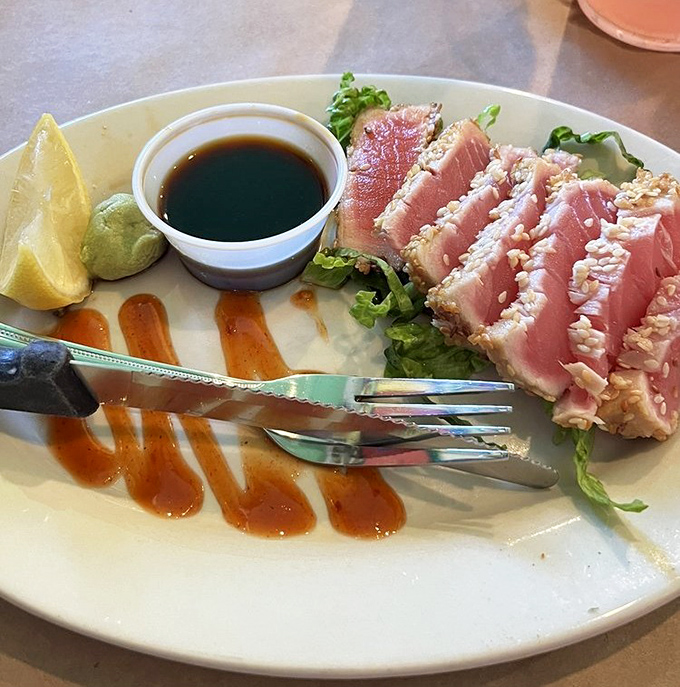 Seared ahi tuna, pink as a Florida sunset, with soy sauce standing by to enhance its ocean-fresh flavor.