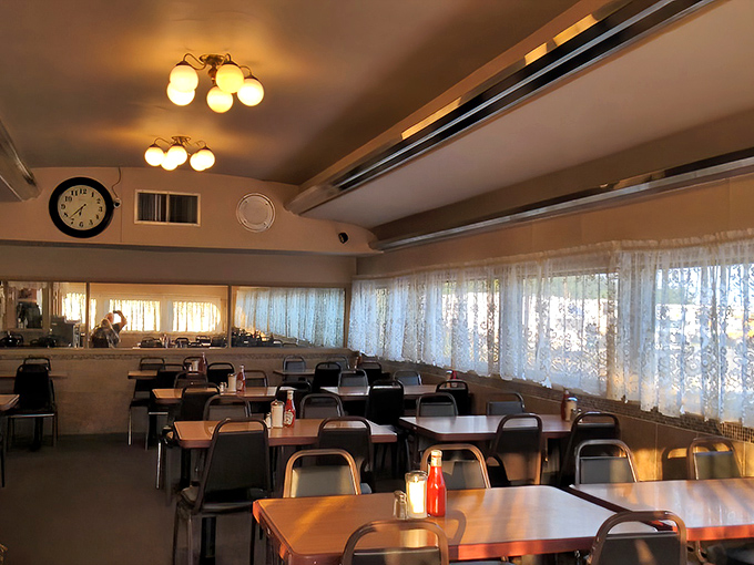 Sunlight streams through lace curtains, transforming an ordinary dining room into a cathedral of comfort food.