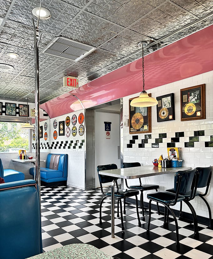 Classic diner aesthetics done right: checkerboard floors, vintage memorabilia, and tables that have hosted thousands of Michigan stories.