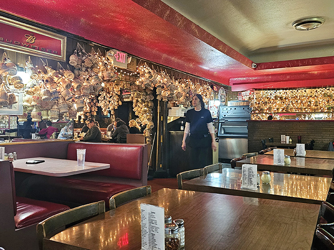 Every inch of wall and ceiling space tells stories&mdash;this isn't decoration, it's a museum of good times with tomato sauce.