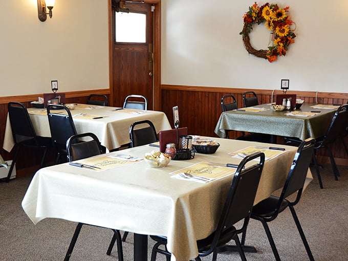 Simple elegance defines the dining room, where white tablecloths and seasonal decorations create the perfect backdrop for memorable meals and milestone celebrations. 