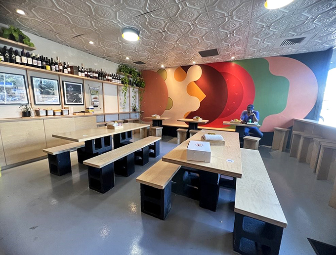 Colorful wall art meets functional design in this space that prioritizes what matters: focusing on your food without distraction.