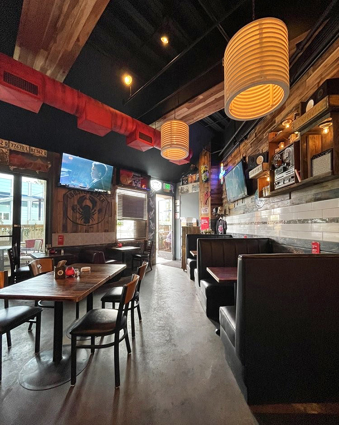 Pendant lights cast a warm glow over wooden tables where seafood dreams come true and diet resolutions go to die.