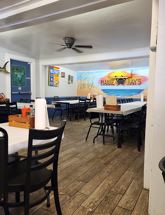 The beach-themed dining room doesn't just serve seafood &ndash; it transports you there. That mural isn't compensation for a view; it's a bonus.
