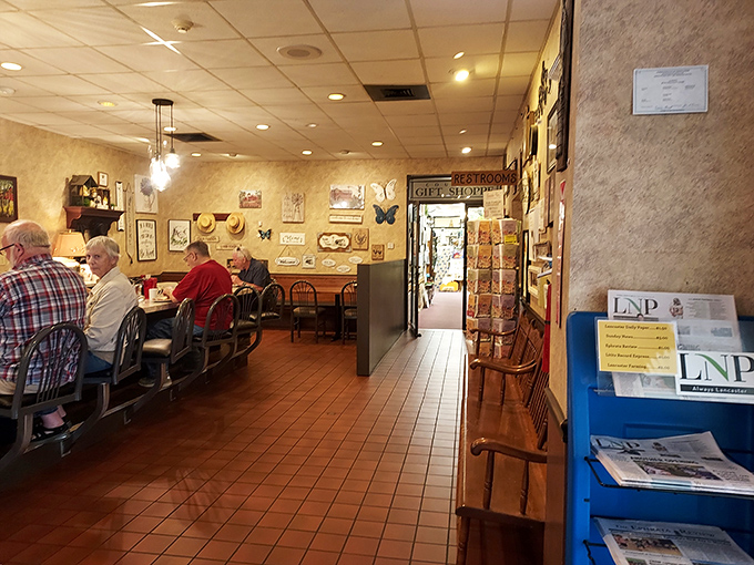 Cozy corner seating with walls adorned in local memorabilia – it's like dining in your Pennsylvania Dutch grandmother's kitchen, if she fed armies.