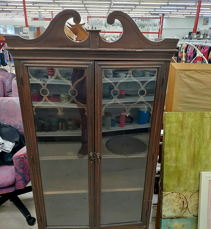 This stately vintage cabinet has stories to tell. Once the pride of someone's dining room, now waiting for its second act in your home.