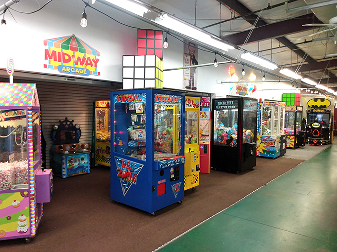 The Midway Arcade: where quarters disappear faster than your retirement fund during a market correction, but with way more flashing lights.